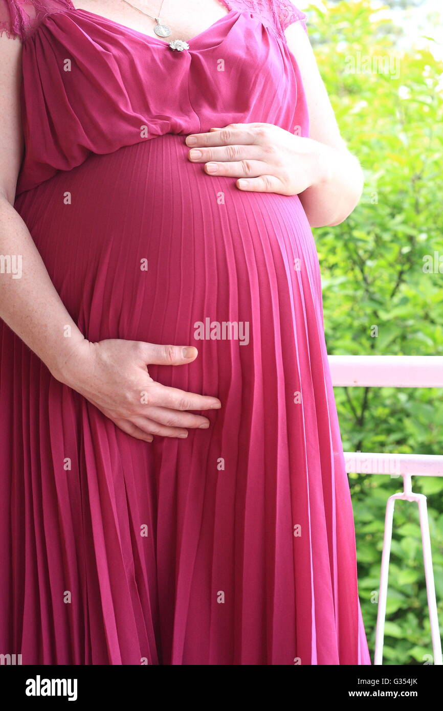 Pregnant woman expecting child Stock Photo - Alamy