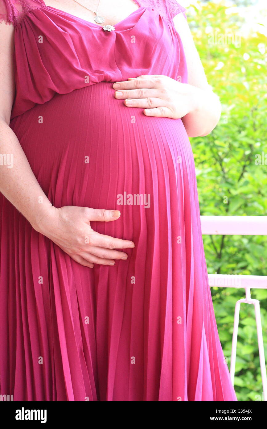 Pregnant woman expecting child Stock Photo - Alamy