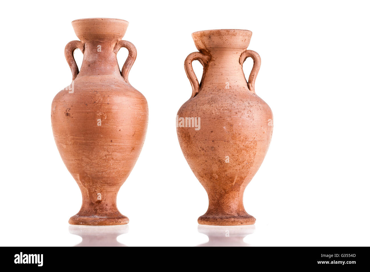 two terracotta amphorae isolated over a white background Stock Photo ...