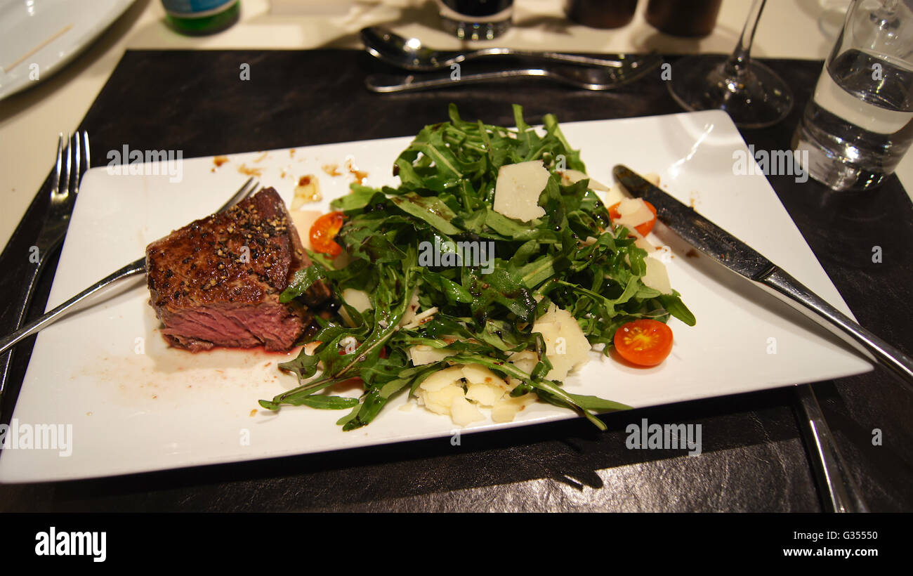 Grilled medium steaks with fresh herbs in First Class Lounge Stock ...