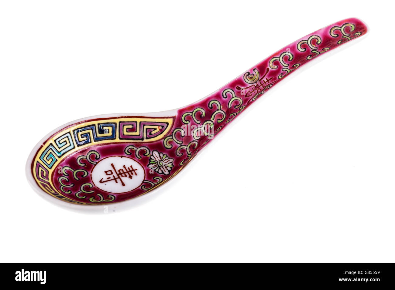 a chinese soup spoon isolated over a white background Stock Photo - Alamy
