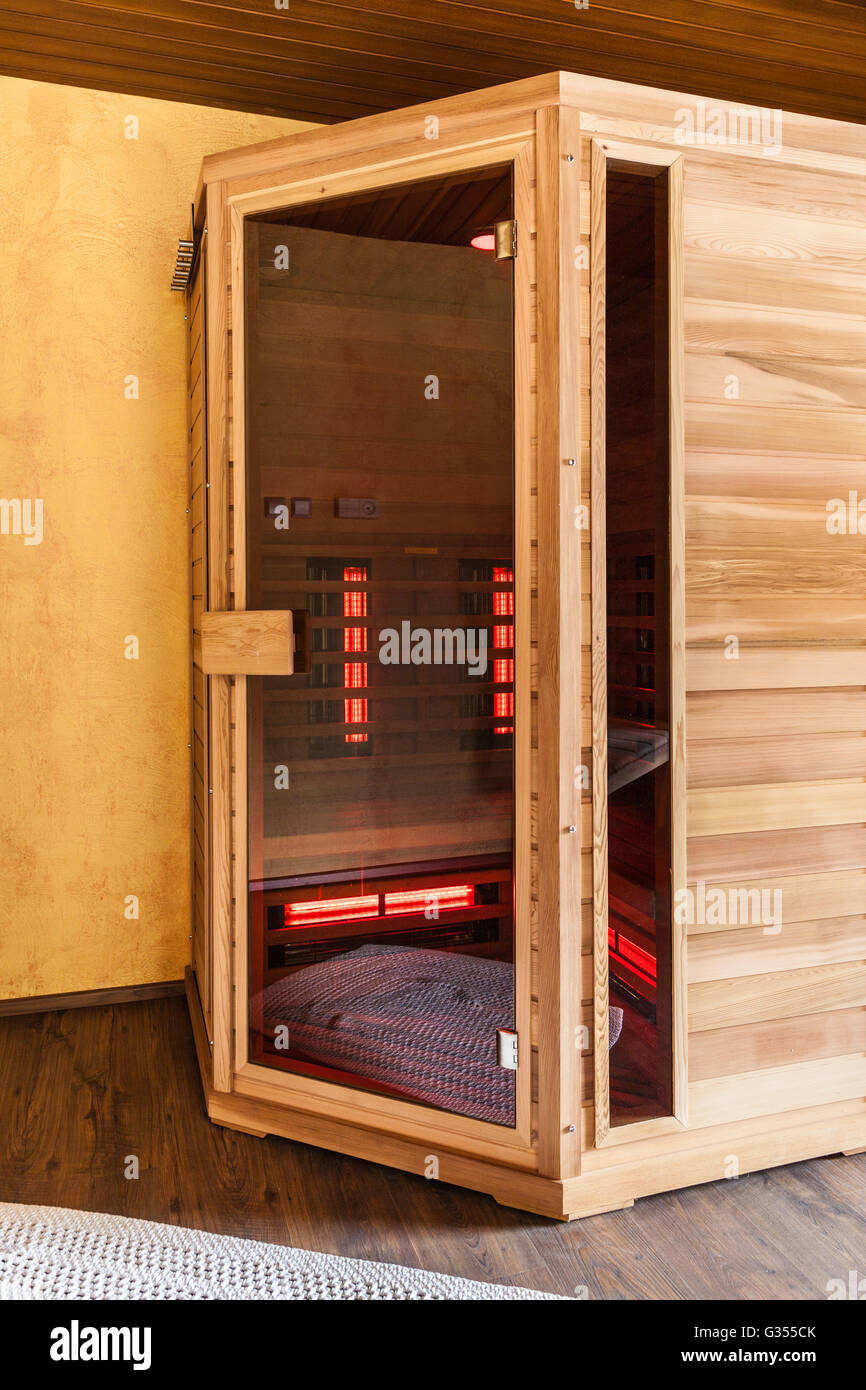 a small wooden infrarered sauna booth in a spa Stock Photo - Alamy