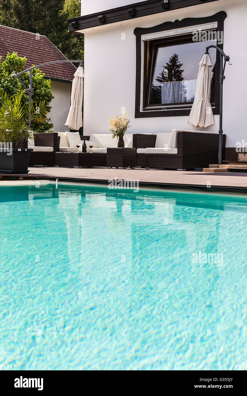 a luxurious lounge on the poolside of a beautiful big pool Stock Photo ...