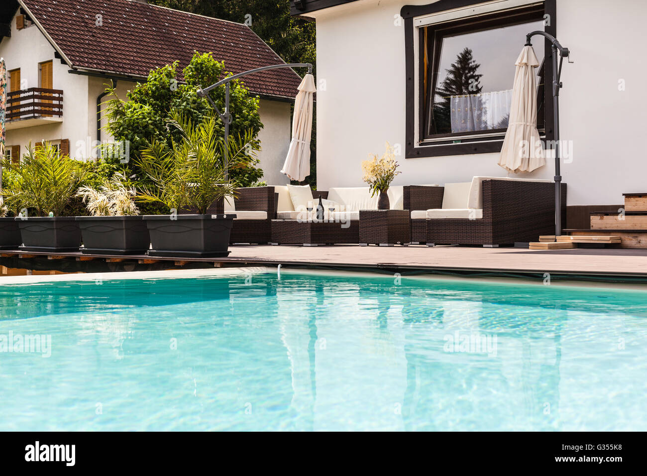 a luxurious lounge on the poolside of a beautiful big pool Stock Photo ...