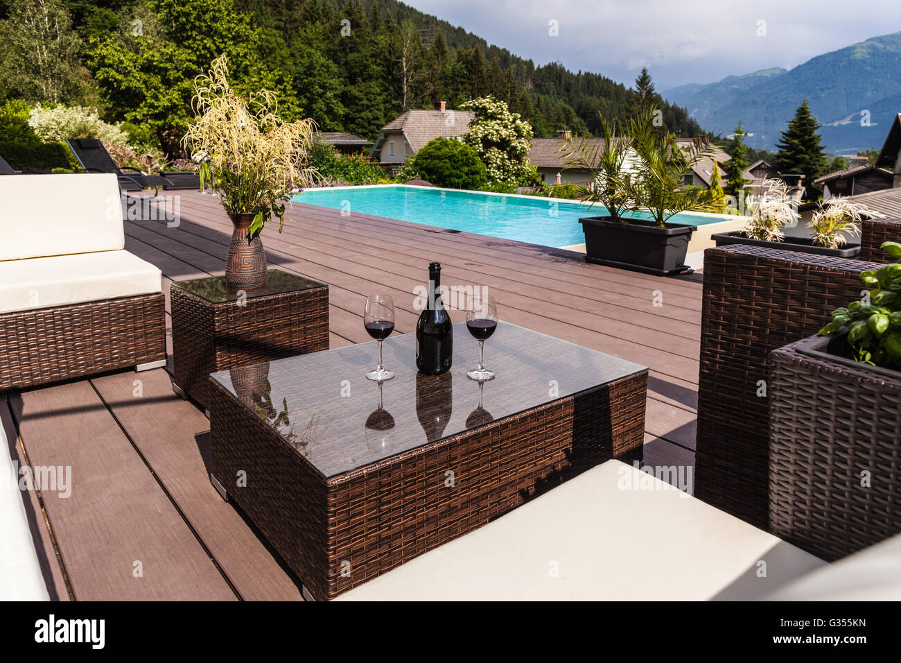 a luxurious lounge on the poolside of a beautiful big pool Stock Photo ...