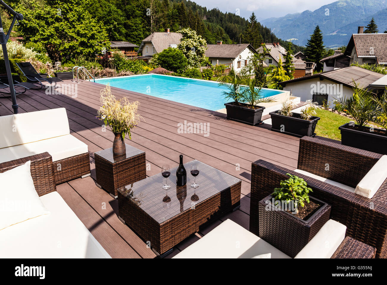 a luxurious lounge on the poolside of a beautiful big pool Stock Photo ...