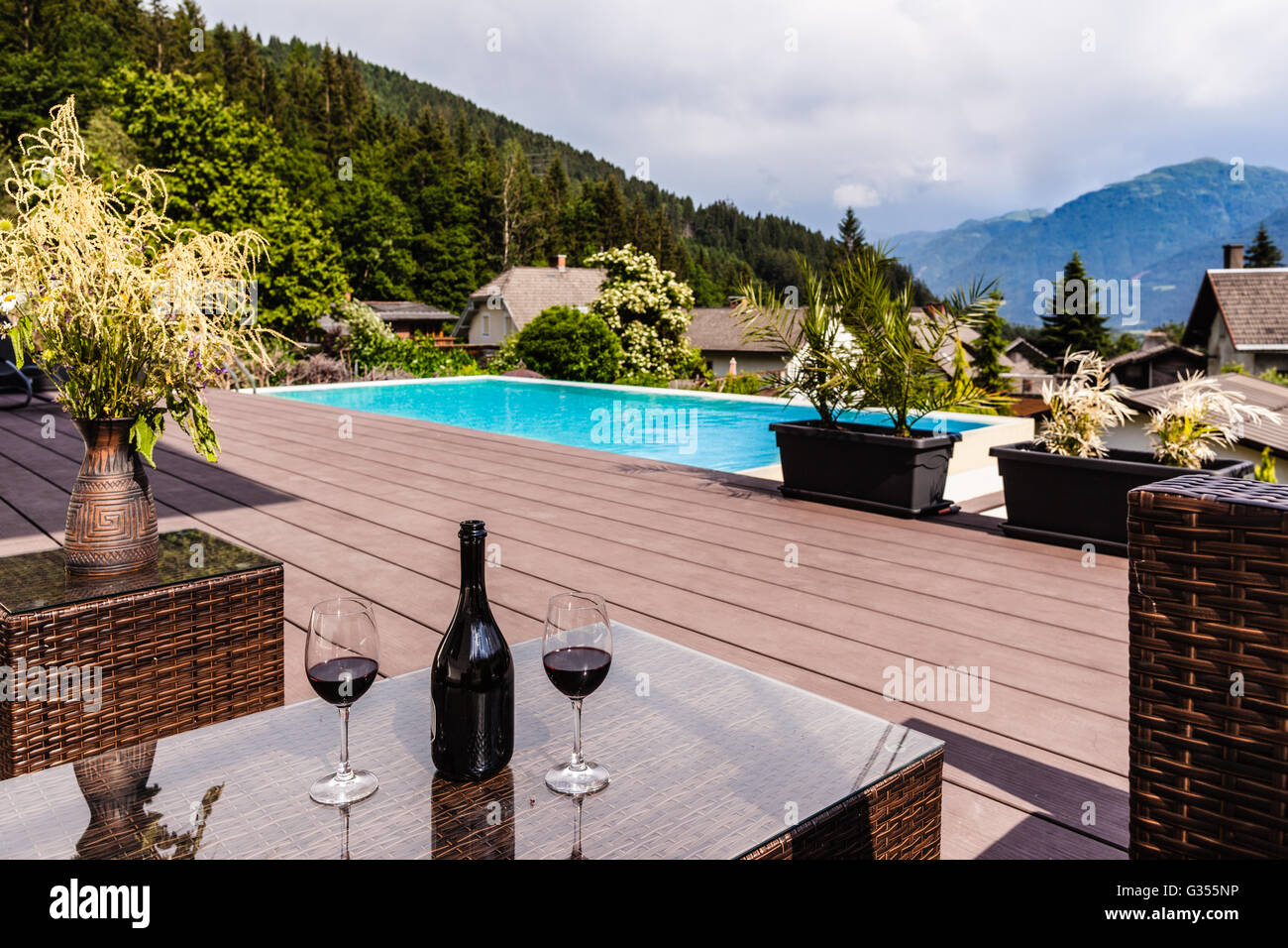 a luxurious lounge on the poolside of a beautiful big pool Stock Photo ...
