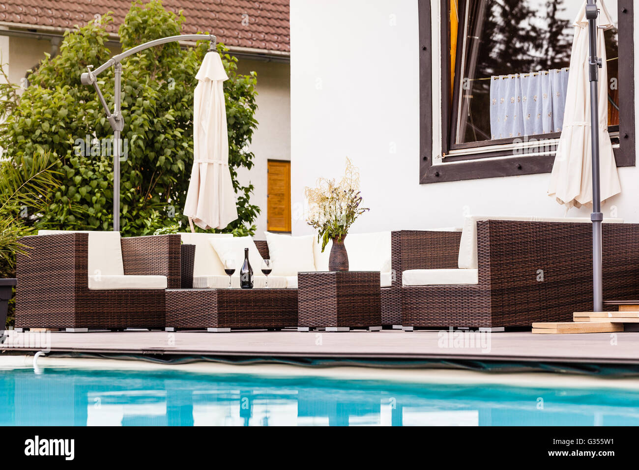 a luxurious lounge on the poolside of a beautiful big pool Stock Photo ...