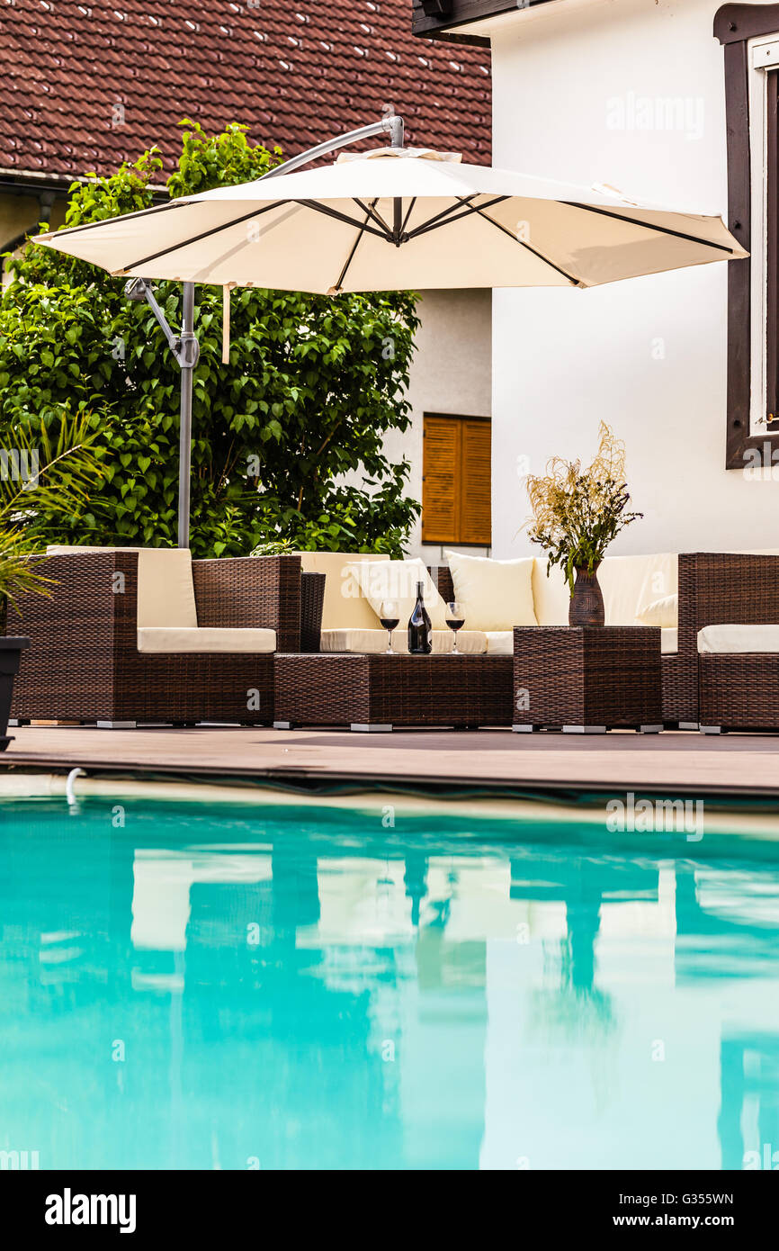 a luxurious lounge on the poolside of a beautiful big pool Stock Photo ...