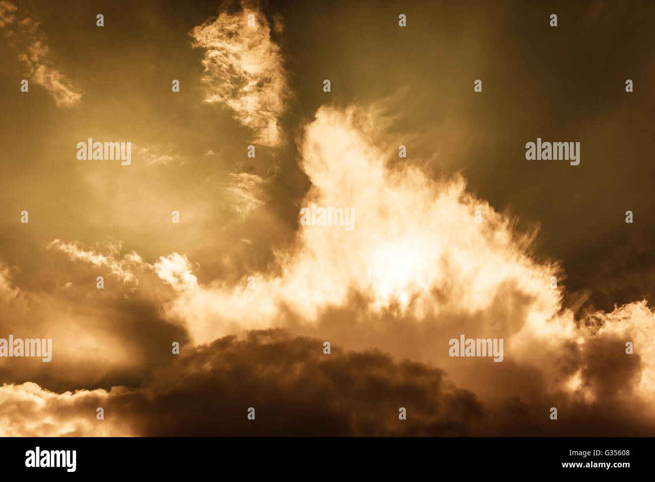 a dramatic cloud formation backlit by the sun at sunset Stock Photo - Alamy
