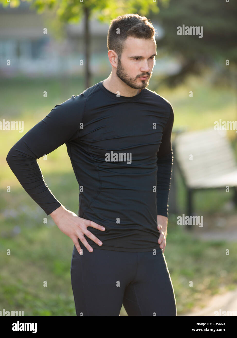 Portrait of Sport and fitness runner man resting on bridge after ...