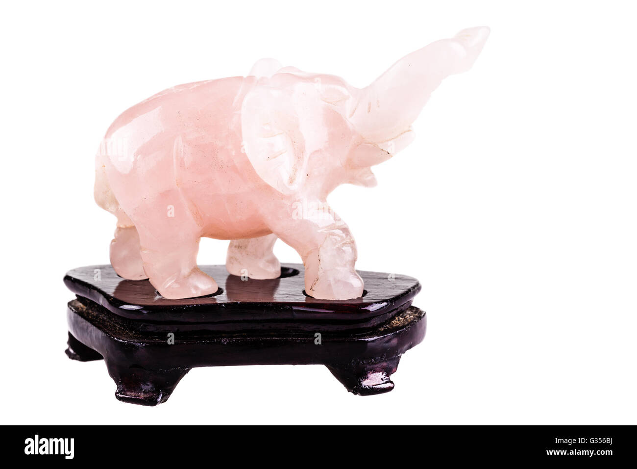 a pink quartz elephant figurine isolated over a white background Stock ...