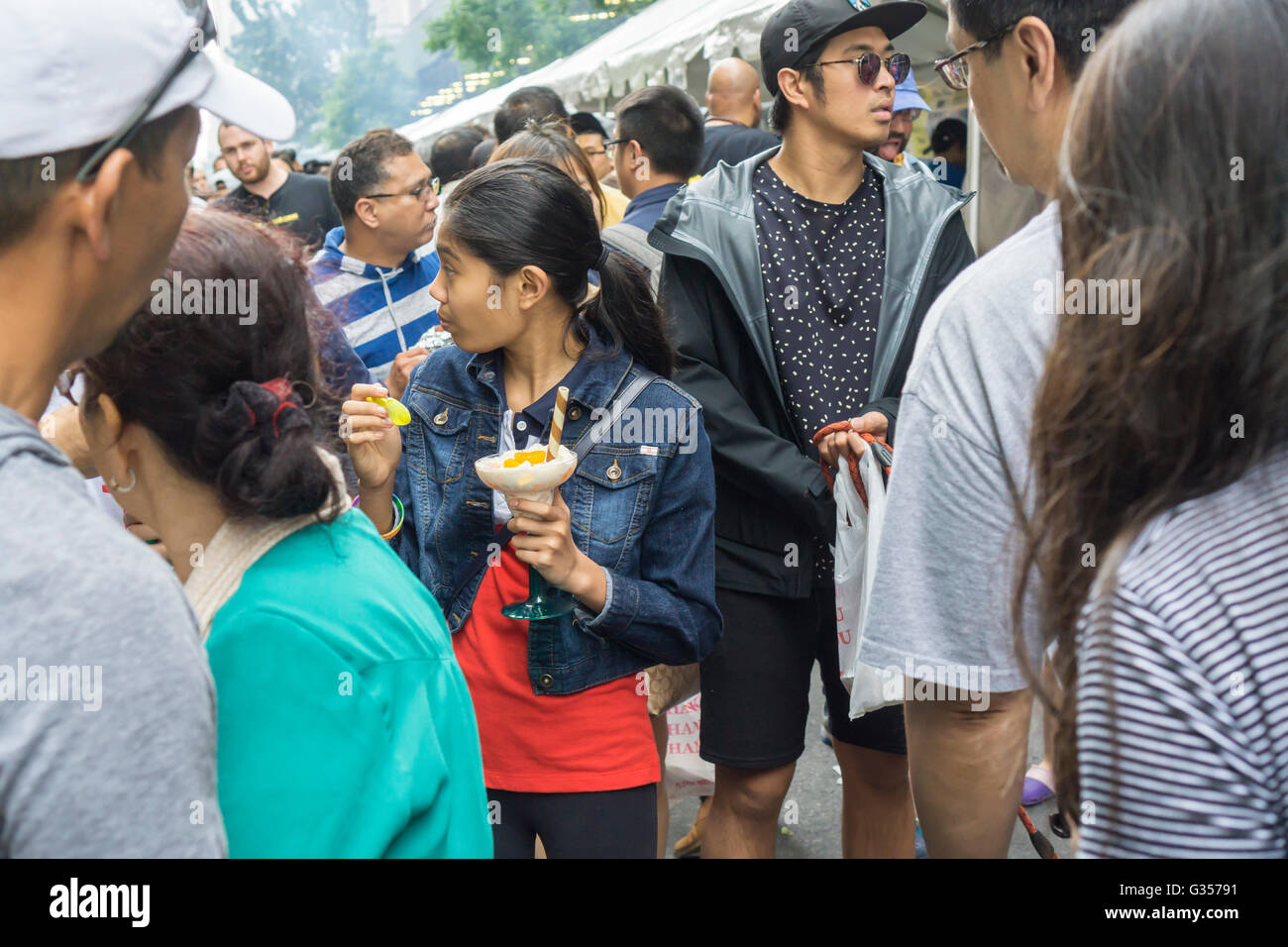 Filipino-Americans from the tri-state area at a street fair following ...