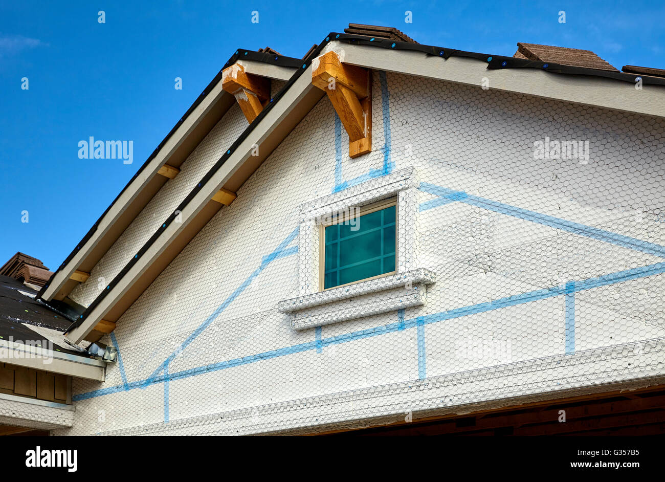 Home building industry double gable roof prep for stucco Stock Photo ...