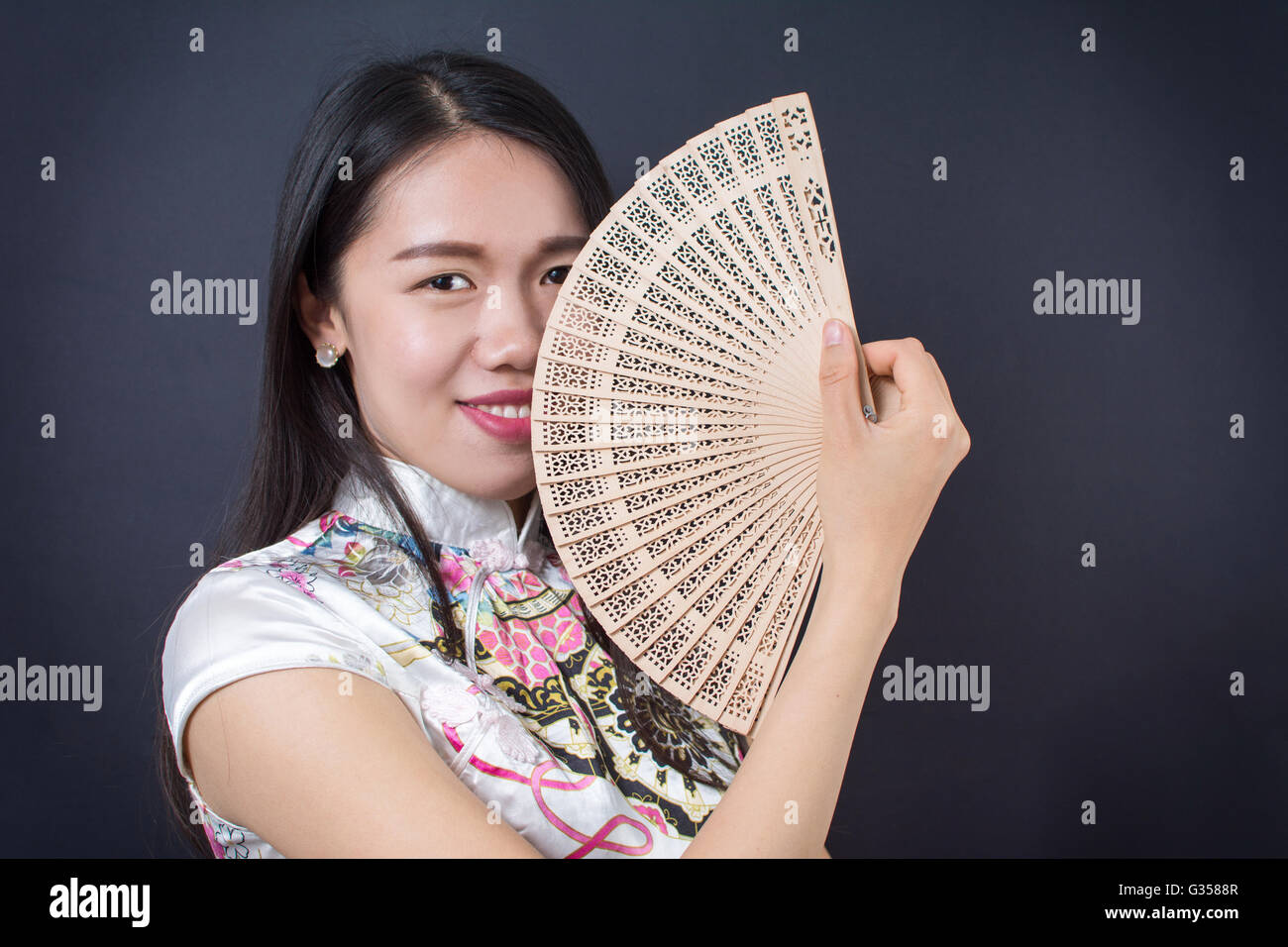 Woman covering face hand fan hi-res stock photography and images - Alamy