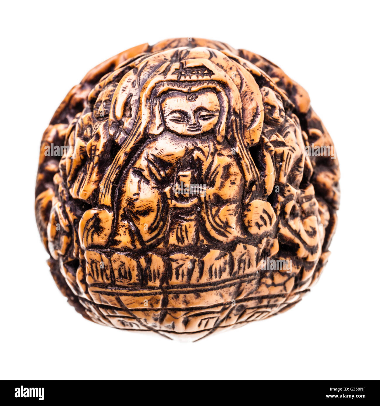 an intricate nut shell carving isolated over a white background Stock ...