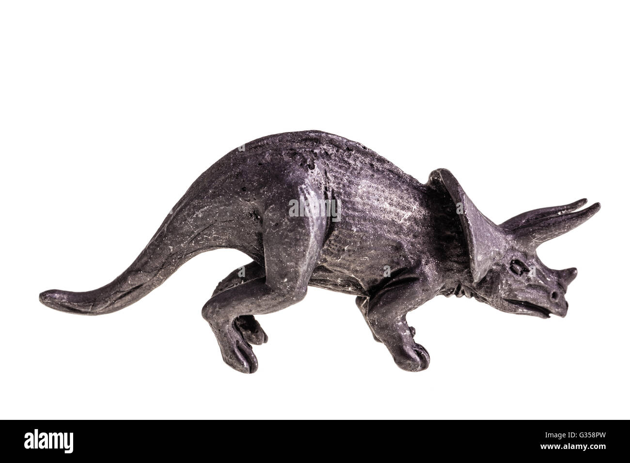 a metal triceratops figurine isolated over a white background Stock ...