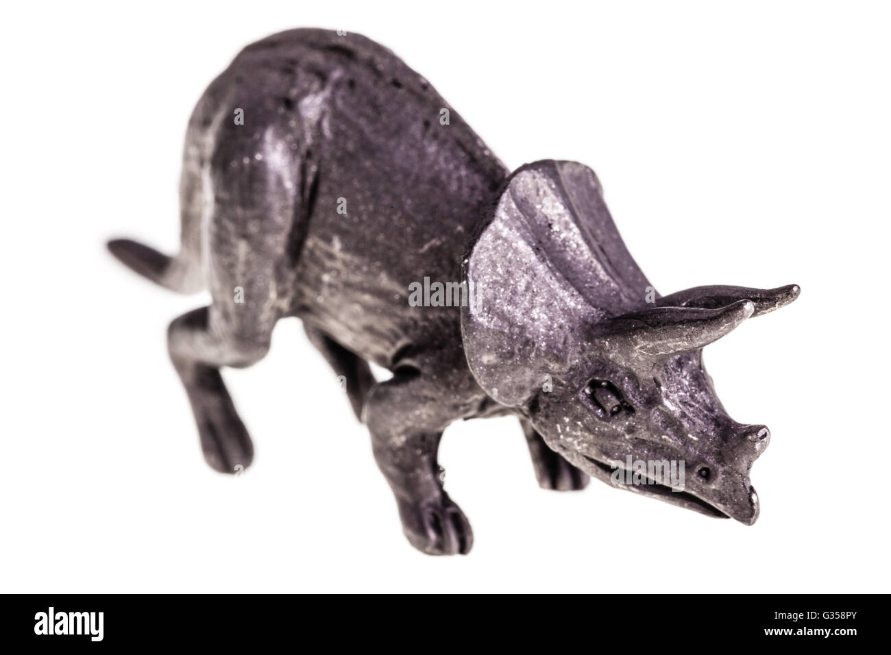 a metal triceratops figurine isolated over a white background Stock ...