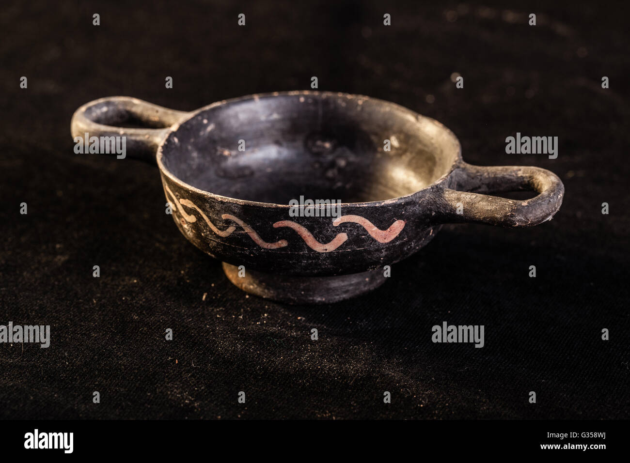 Apulian black pottery ancient canosan bowl over a dark background Stock ...