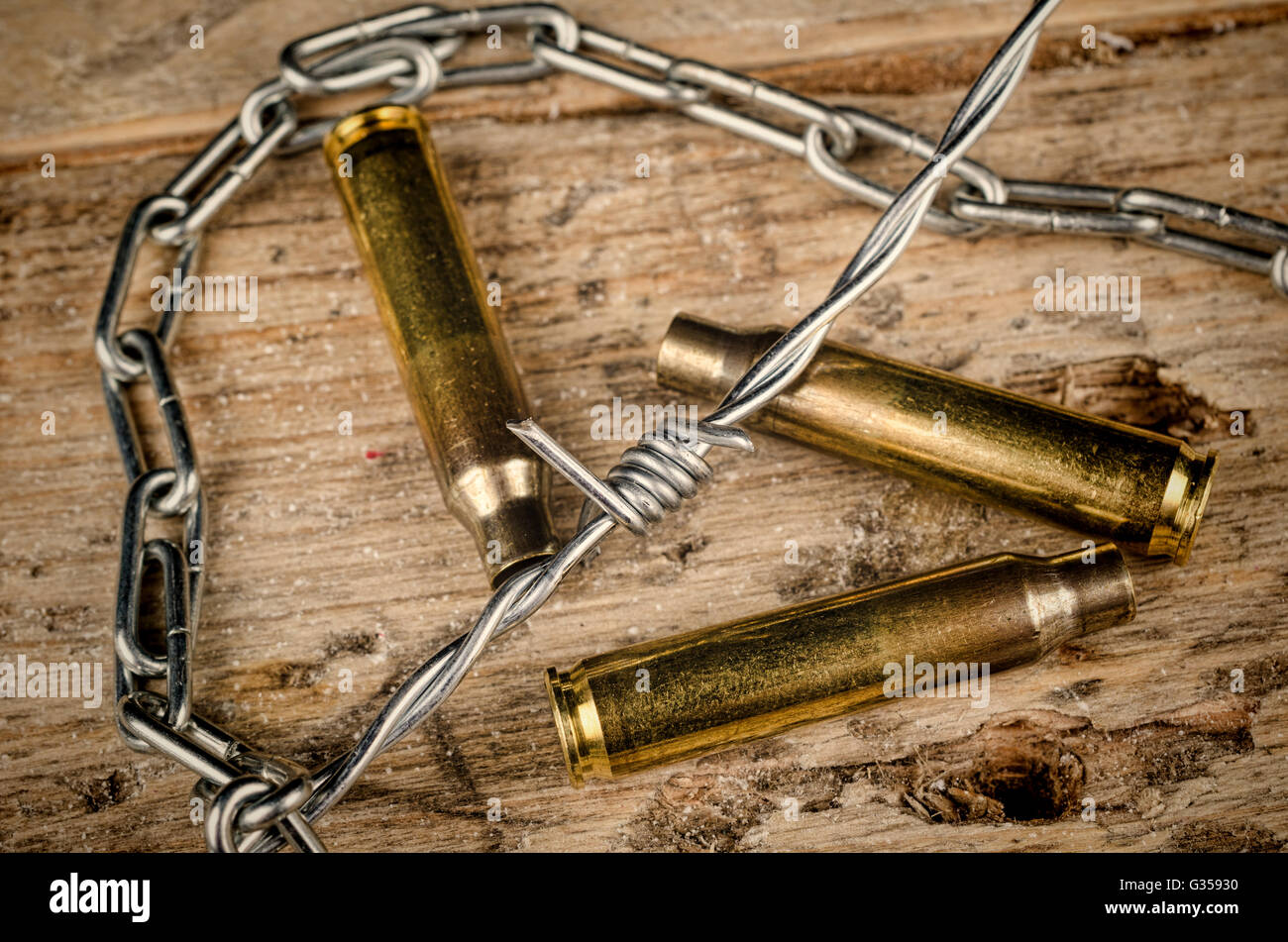 Bullet shells and barbed wire, a concept Stock Photo - Alamy