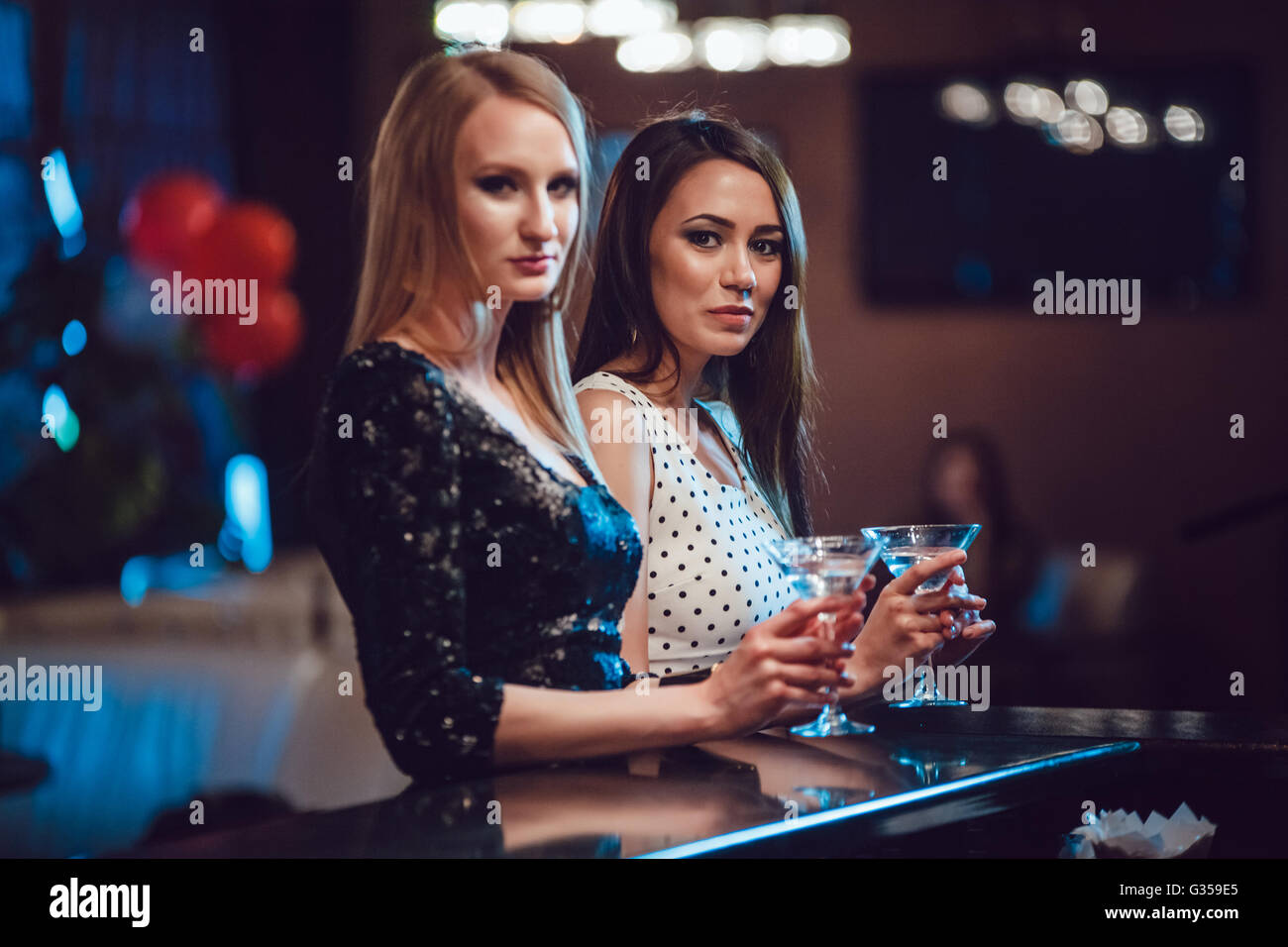 Beautiful girls having fun at a party in nightclub Stock Photo - Alamy