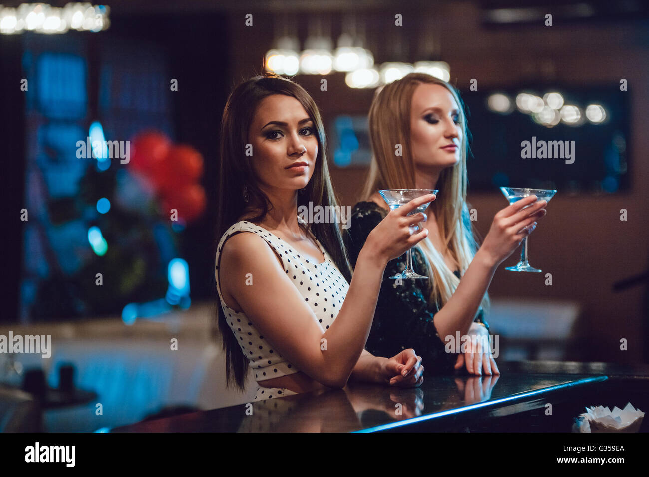 Beautiful girls having fun at a party in nightclub Stock Photo - Alamy