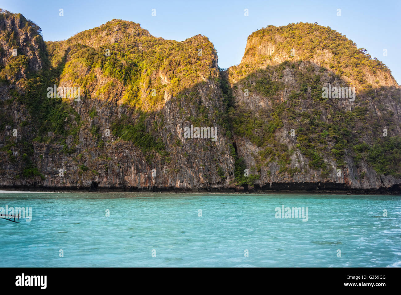 Maya Bay is sheltered by high cliffs on three sides with several ...