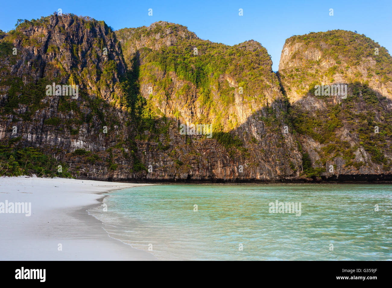 Maya Bay is sheltered by high cliffs on three sides with several ...