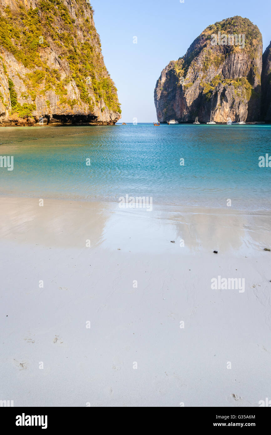 Maya Bay is sheltered by high cliffs on three sides with several ...