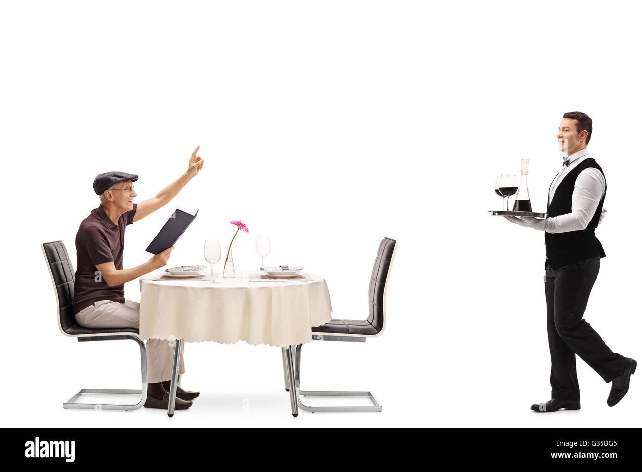 Elderly man sitting at a restaurant table and calling the waiter ...