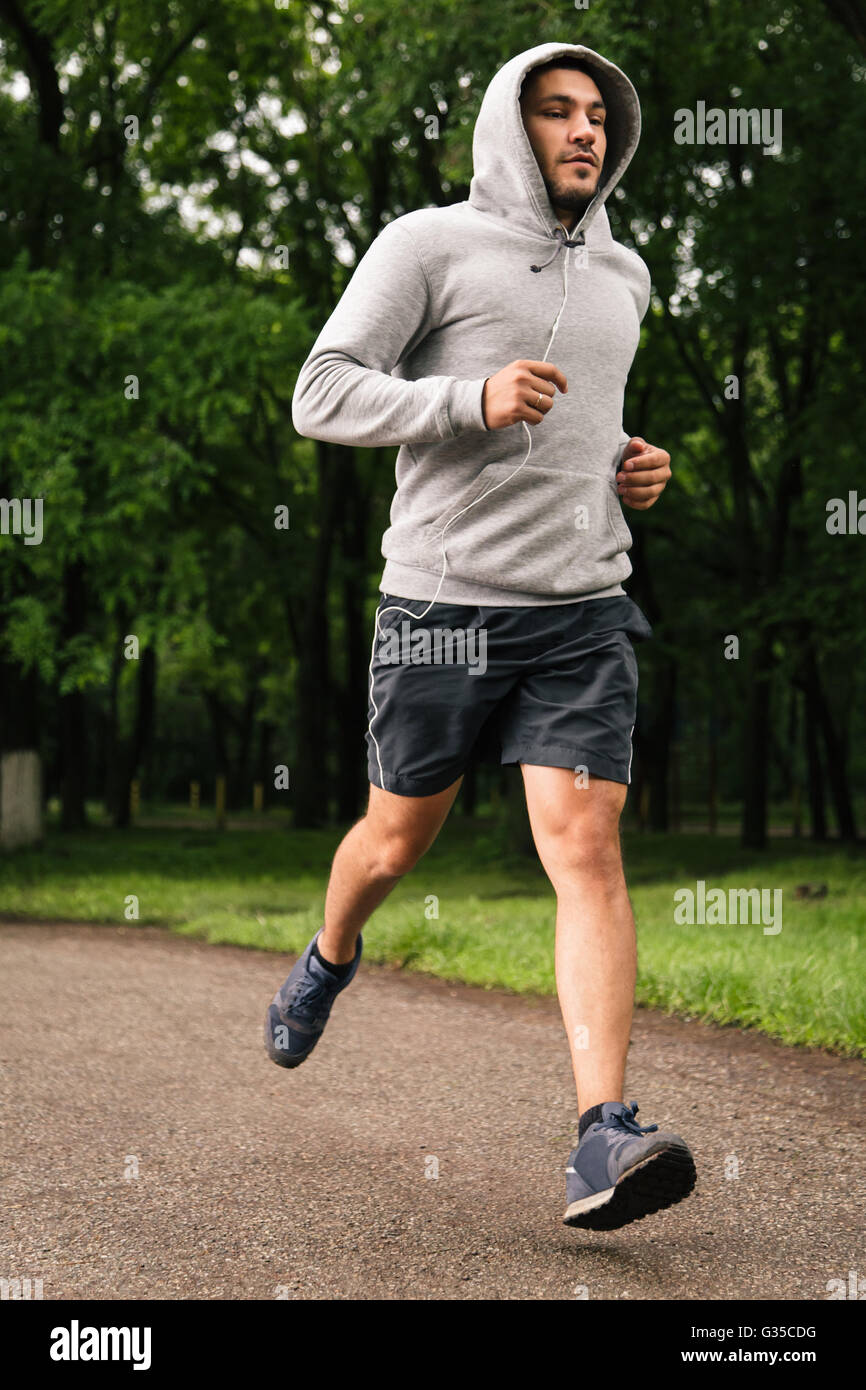 Man running in park Stock Photo - Alamy