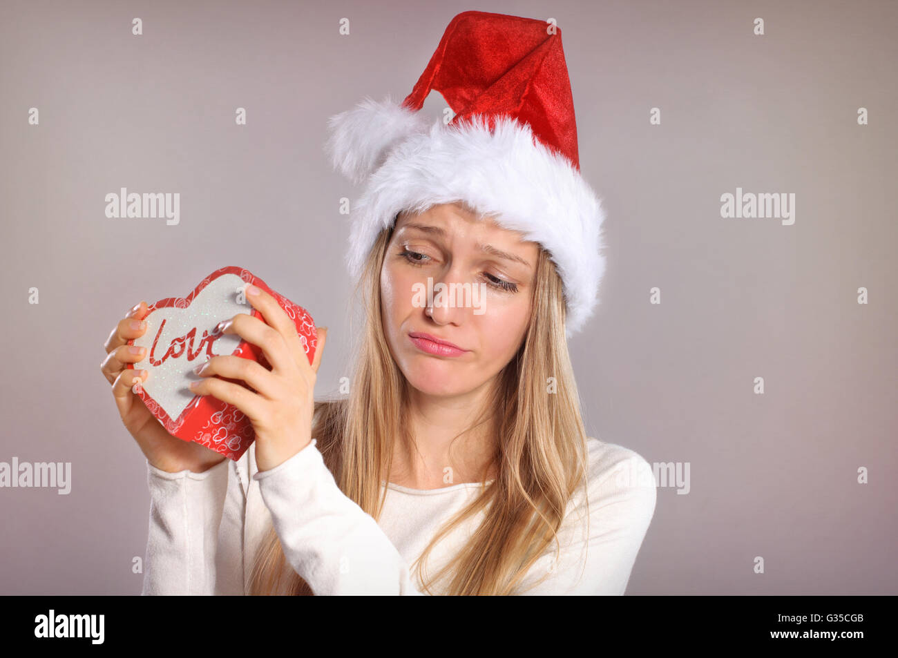 Disappointed girl with a gift box hi-res stock photography and images ...