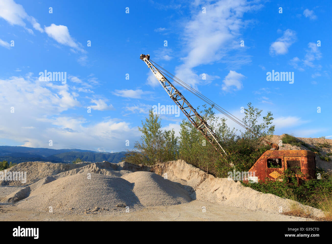 Quarry crane out of service. Industrial machinery. Mining Stock Photo ...
