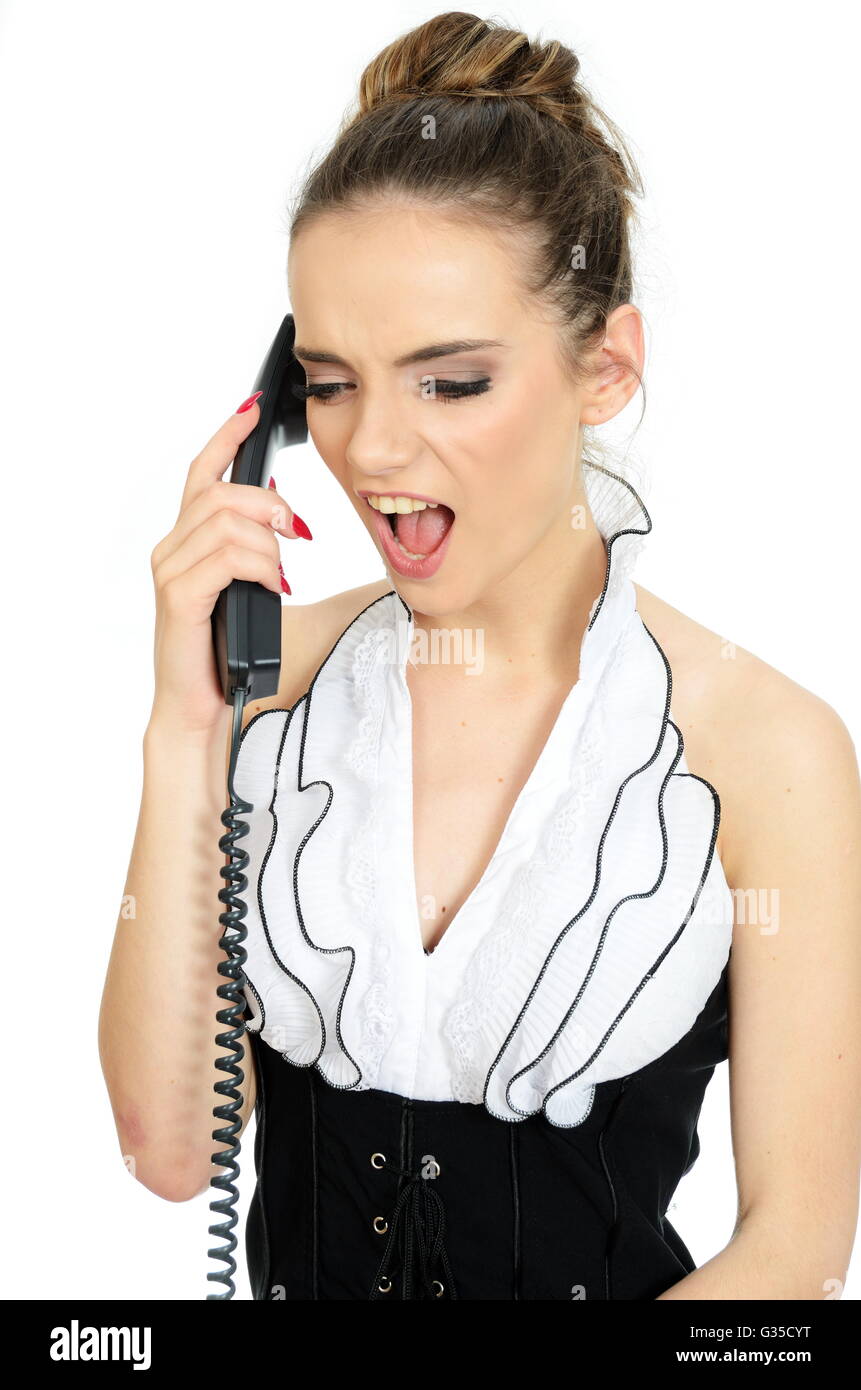 Young office lady screams on phone. Female model holds cable phone in ...