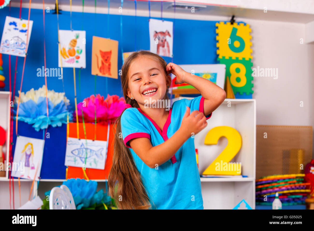 Happy laughing child in preschool class Stock Photo - Alamy