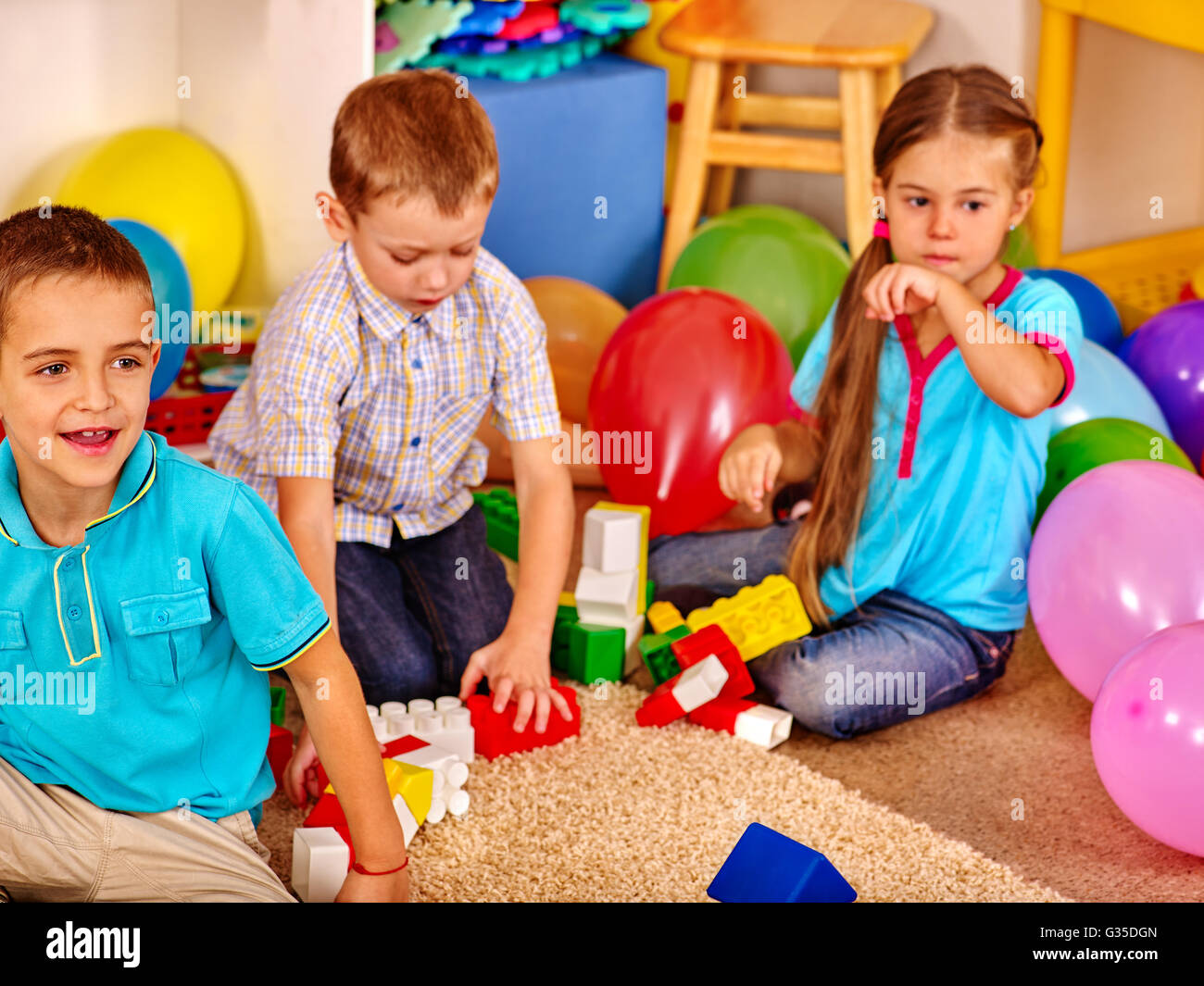 Group children game blocks on floor Stock Photo - Alamy