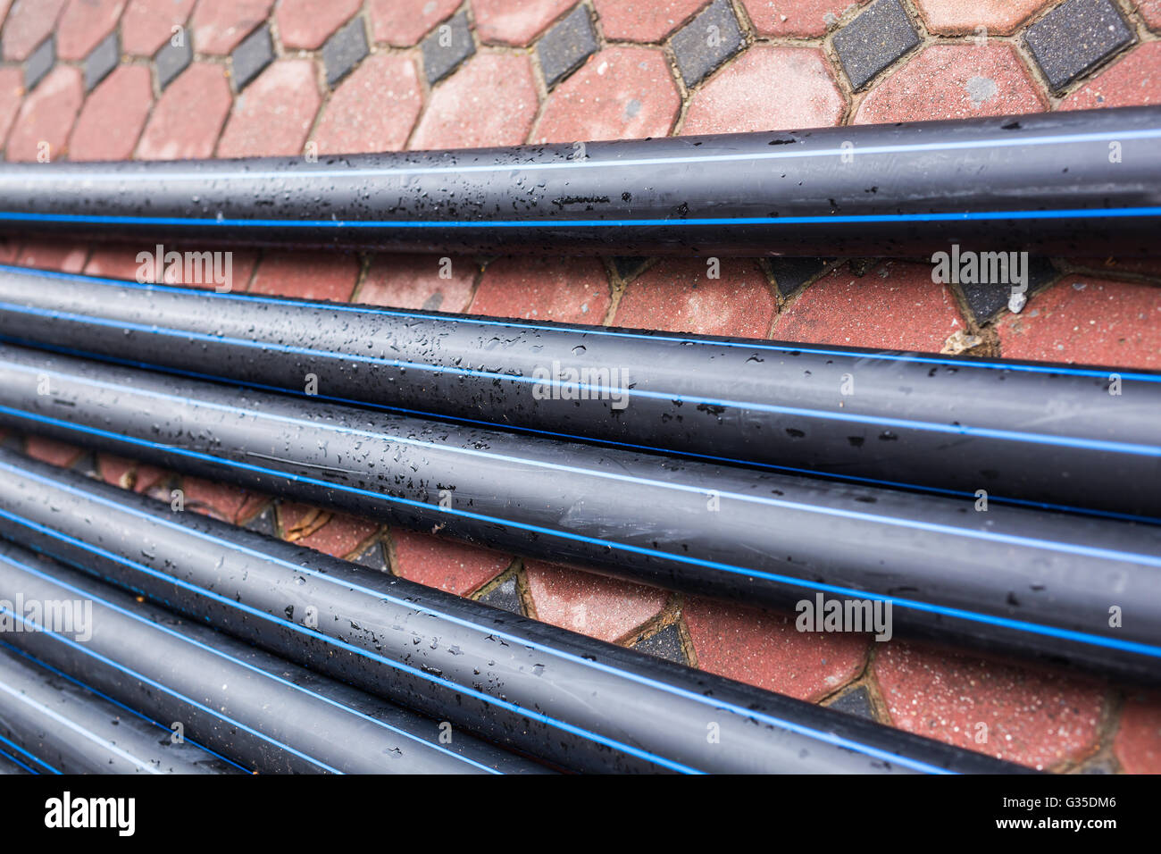 background of colorful big plastic pipes Stock Photo - Alamy