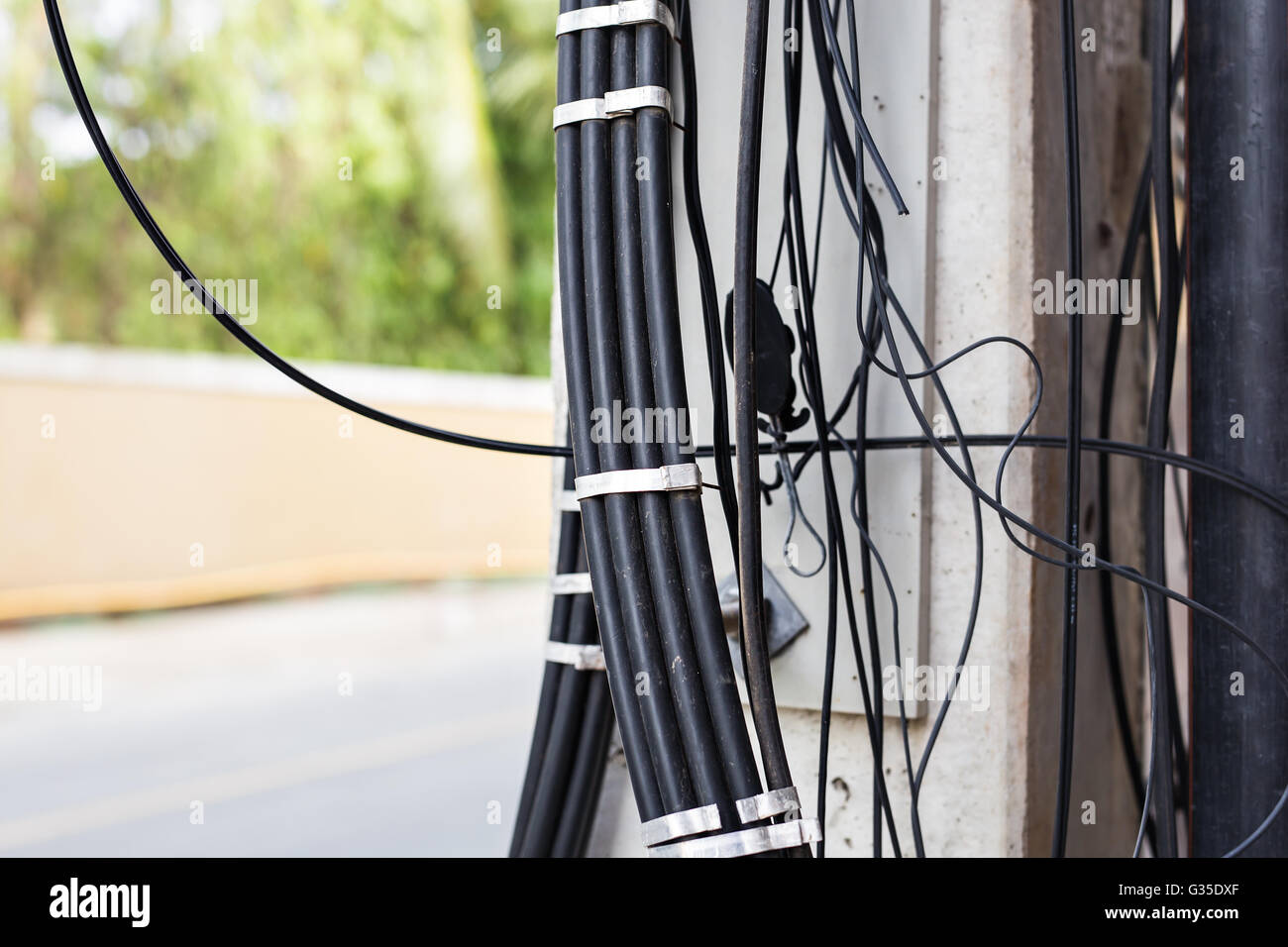 Messy electrical cables in thailand - Uncovered optical fiber ...