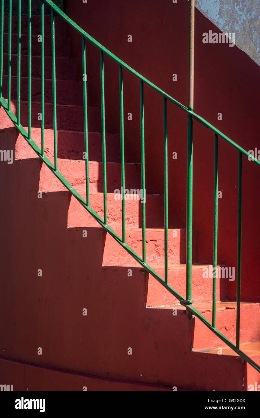 Red stairs and green railing Stock Photo - Alamy