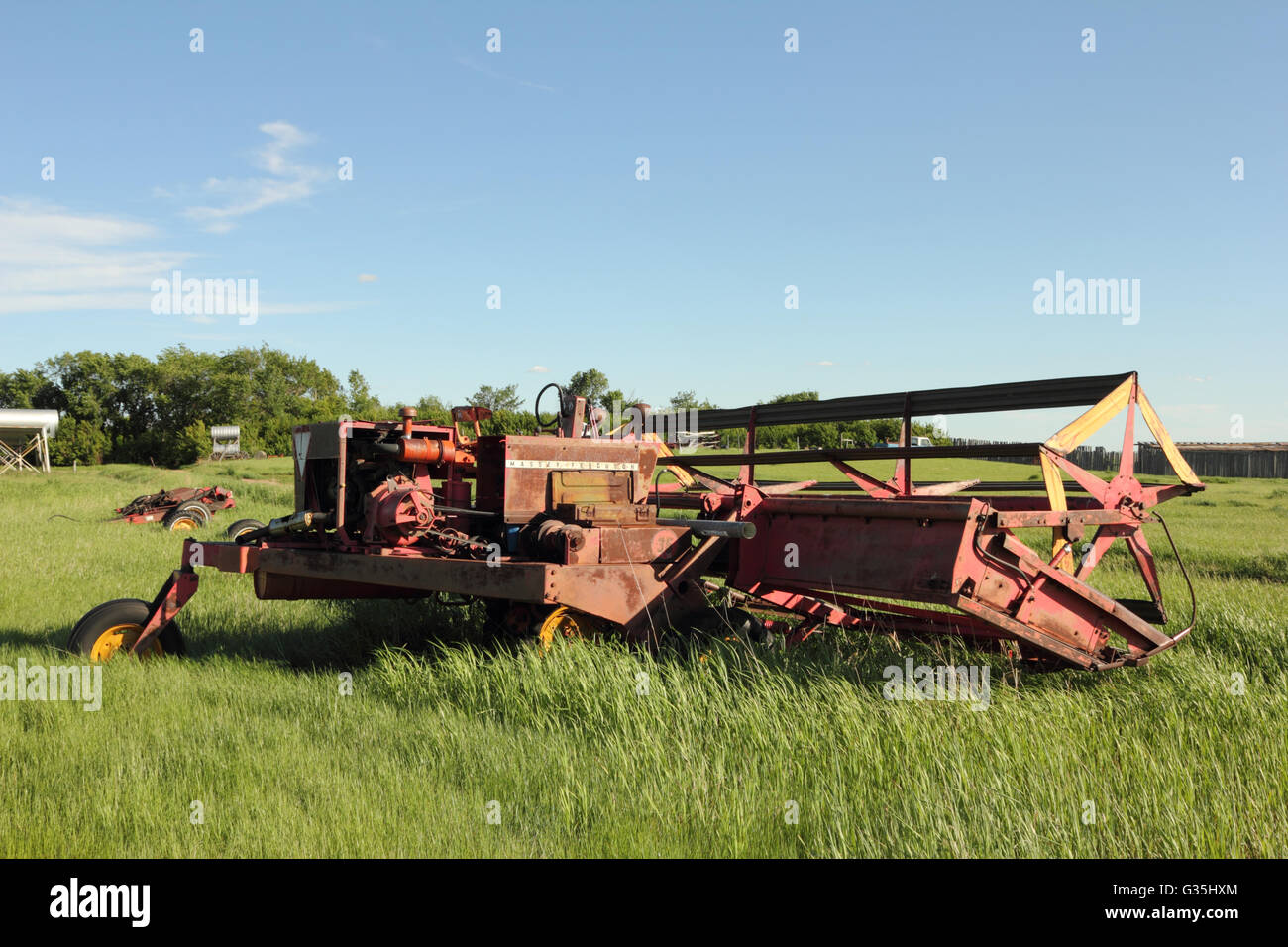 An old Massey Ferguson self-propelled swather on a farm in Alberta ...