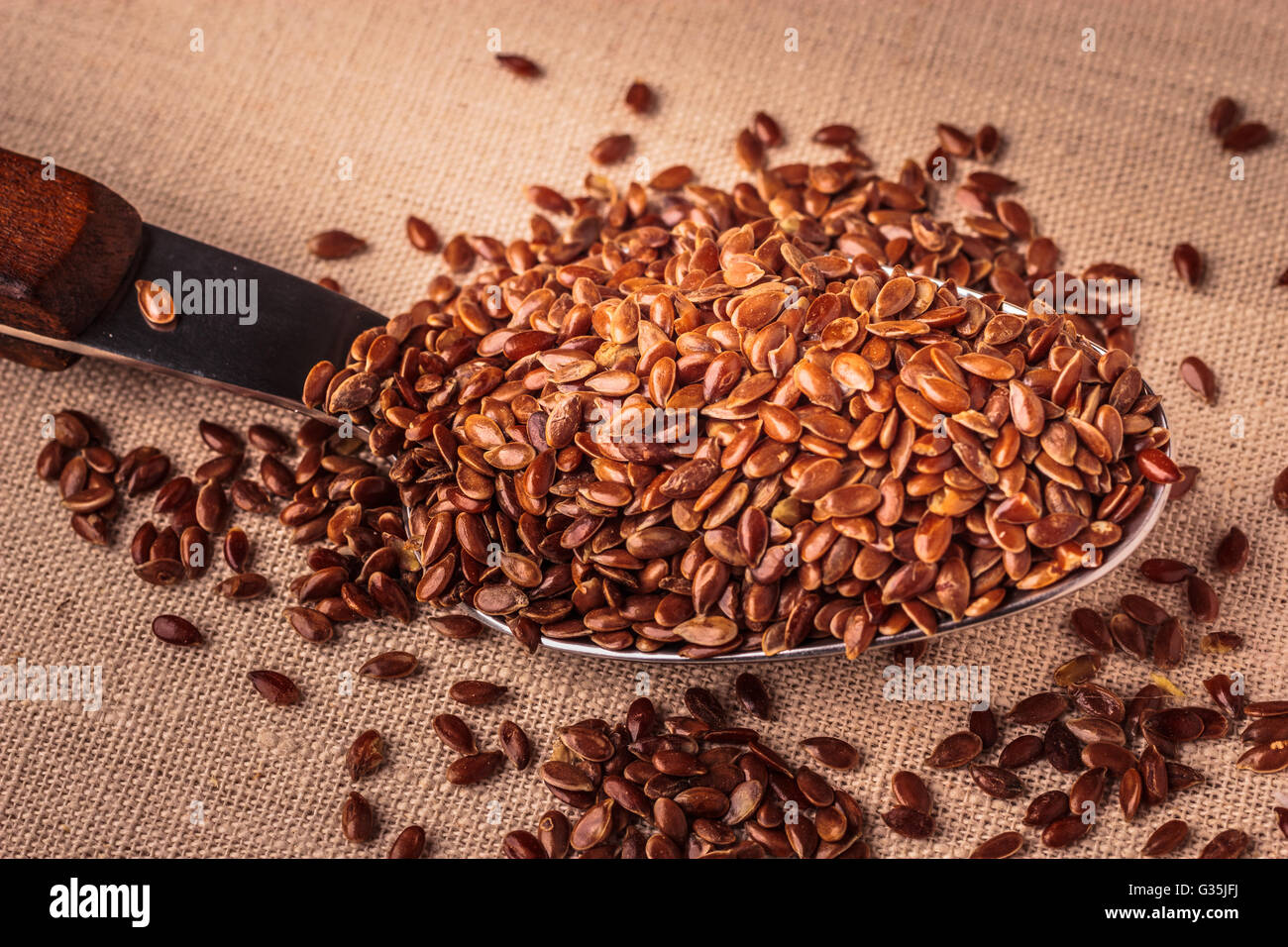 Healthy food. Flax seeds linseed on kitchen spoon burlap sack background Stock Photo - Alamy