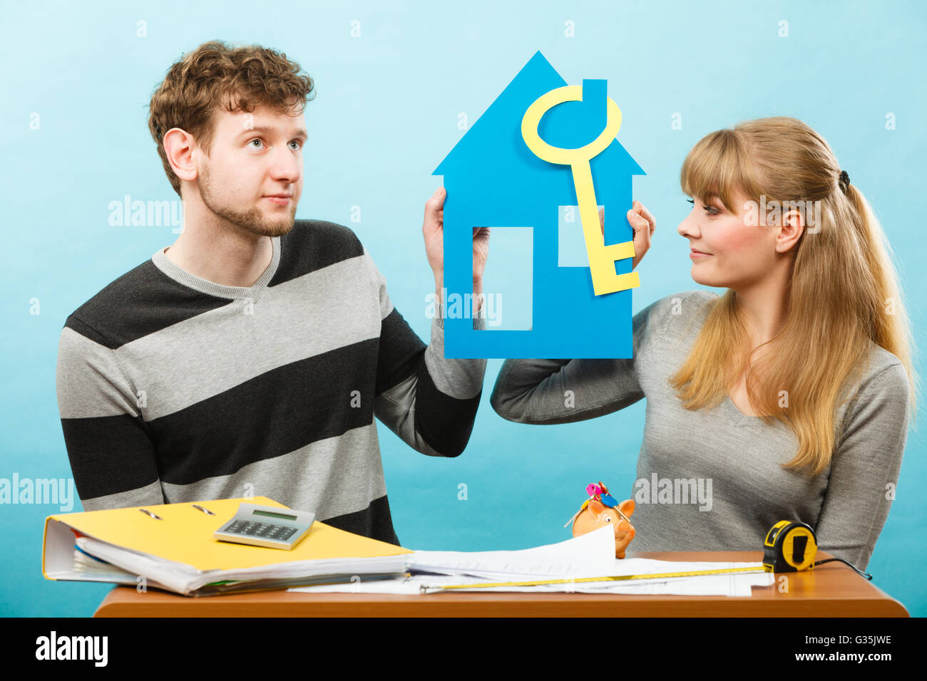Project and design concept. Couple young marriage with model of their ...