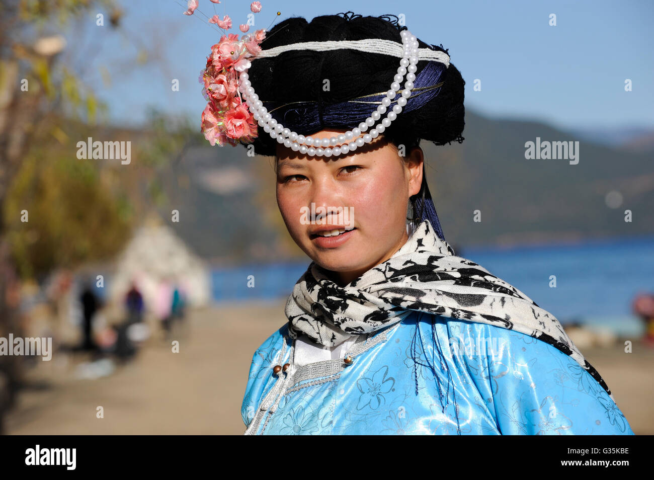 CHINA Yunnan Lugu Lake , ethnic minority Mosuo who are buddhist and ...