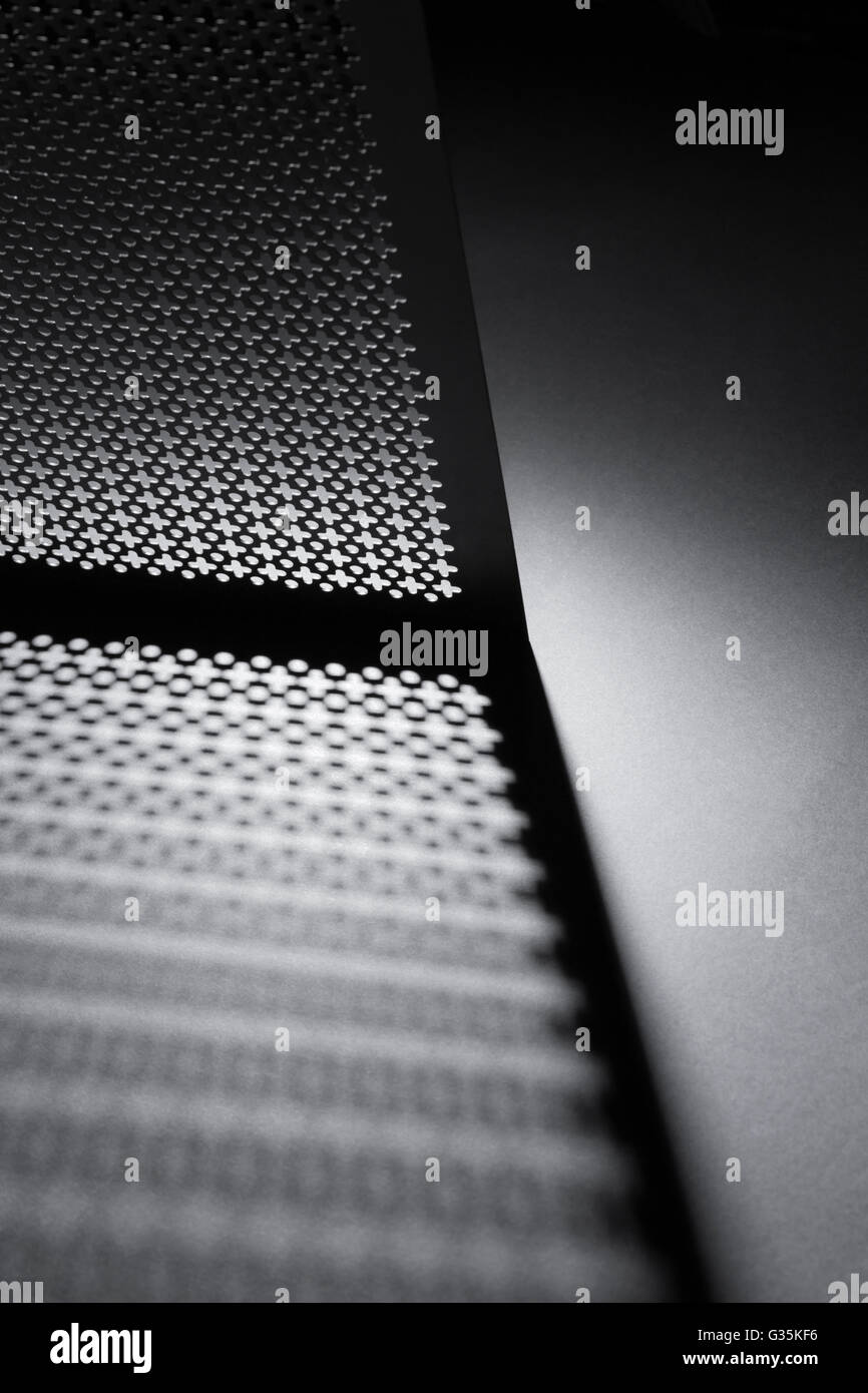 Steel mesh and shadows Stock Photo - Alamy