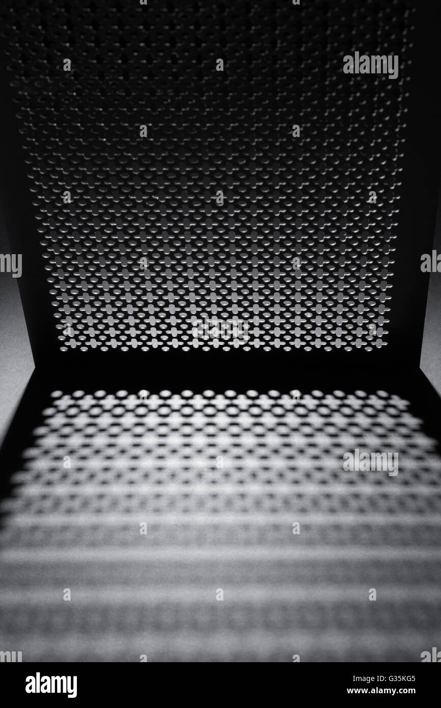 Steel mesh and shadows Stock Photo - Alamy