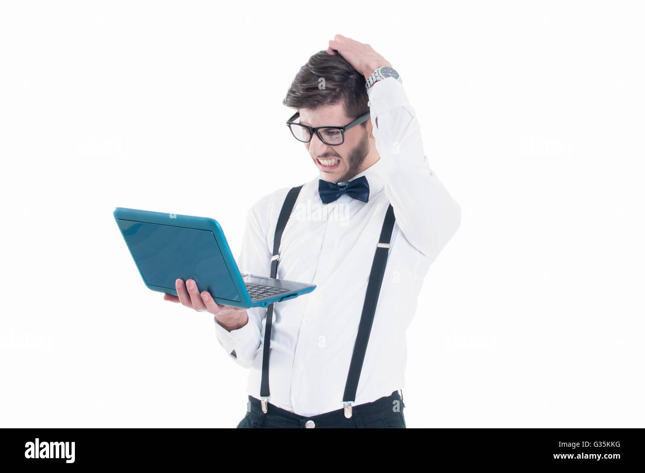 Young business man looking at his laptop with disappointment. Isolated ...