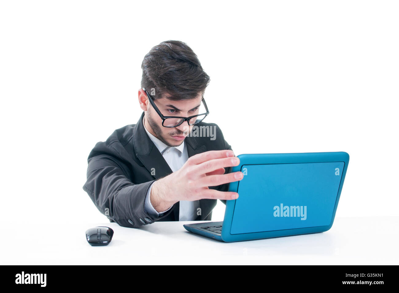 Young business man looking at his laptop with disappointment. Isolated ...