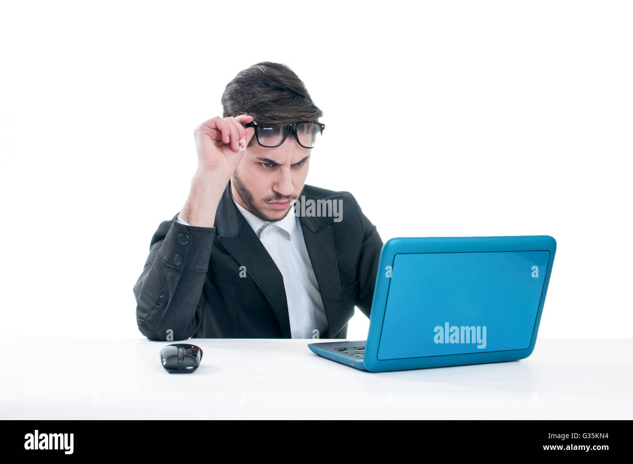 Young business man looking at his laptop with disappointment. Isolated ...
