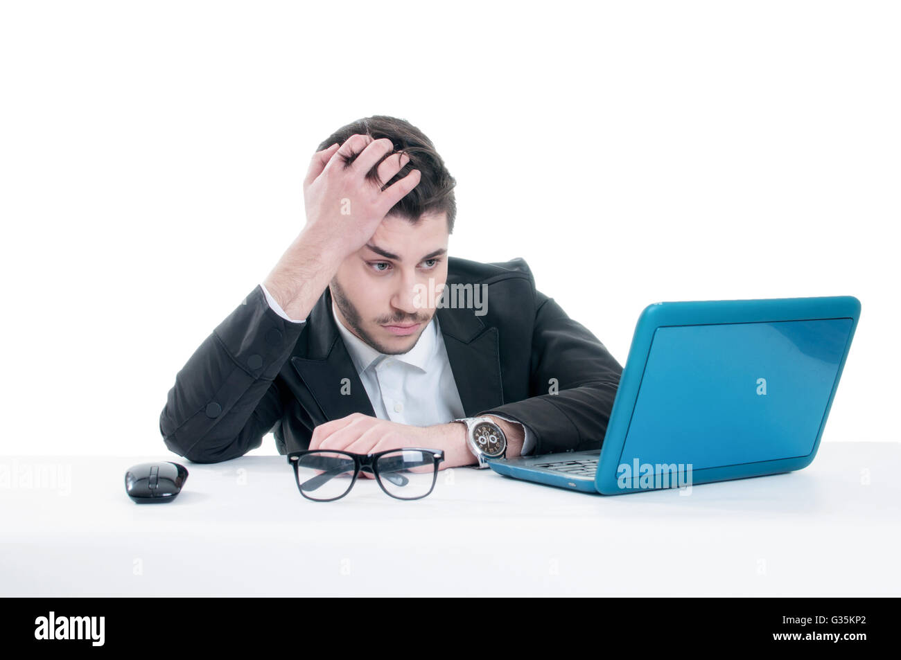 Young business man looking at his laptop with disappointment. Isolated ...