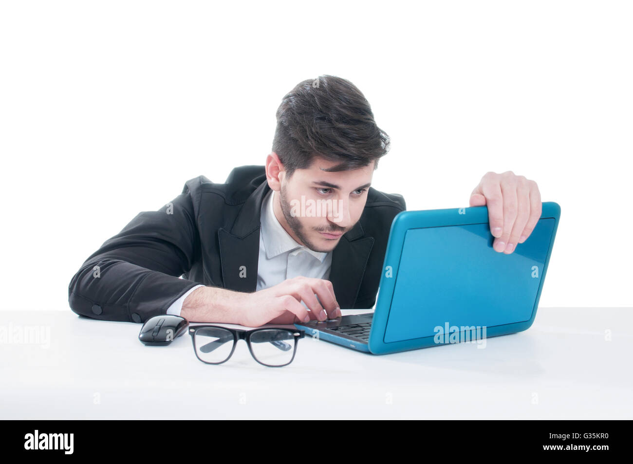 Young business man looking at his laptop with disappointment. Isolated ...